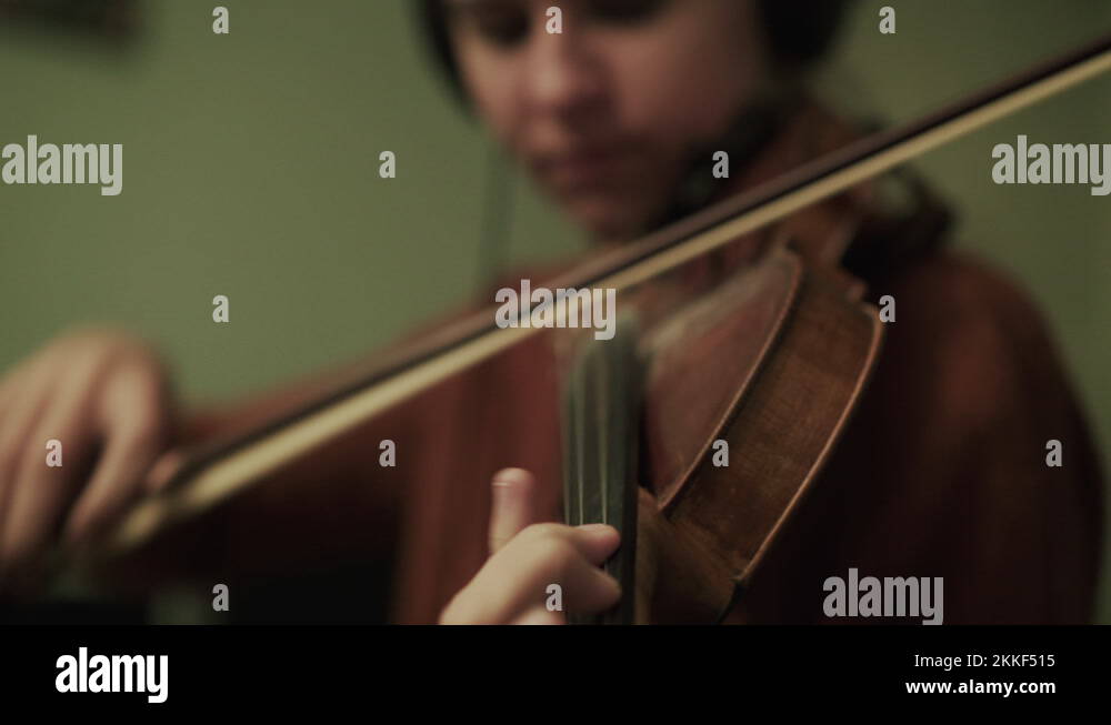 Female artist rehearsing the instrumental melody with violin using ...