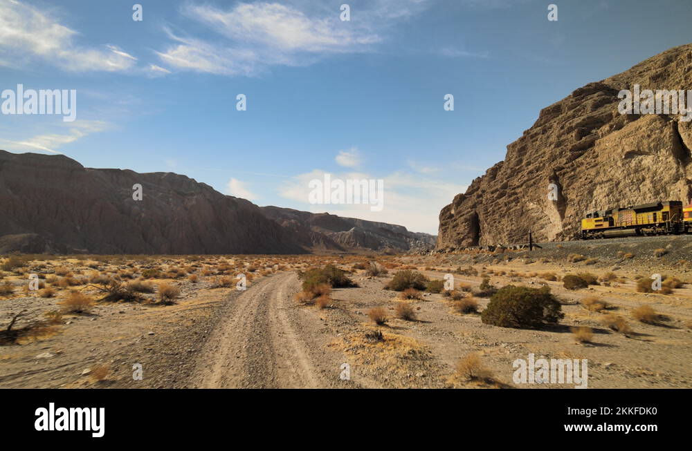 A freight train winds along a single railroad track through Afton ...