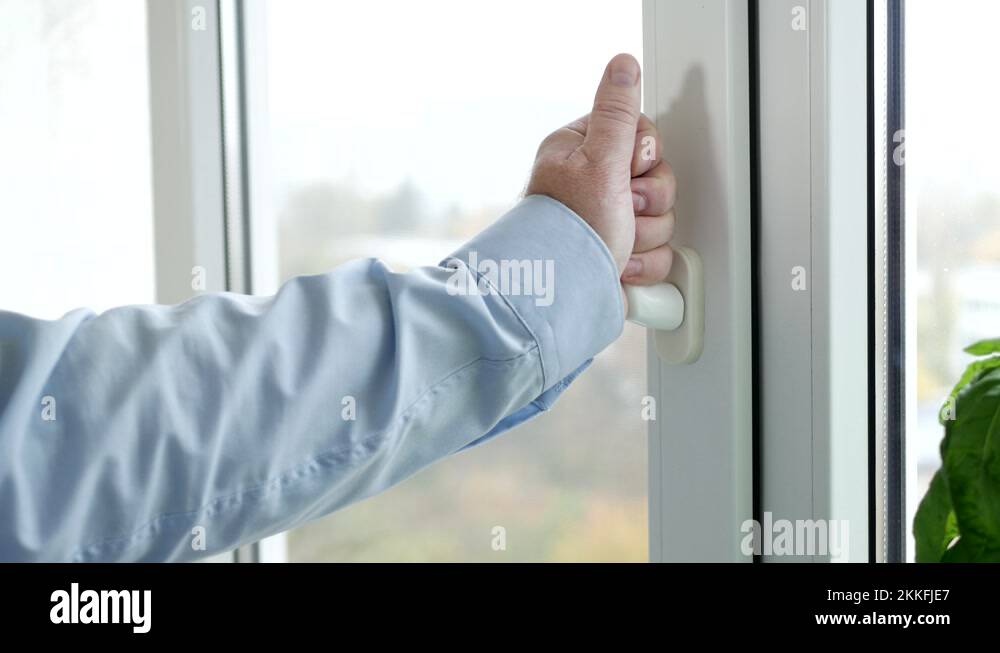 Hand of a Man Closing a Window from the Office Stock Video Footage - Alamy
