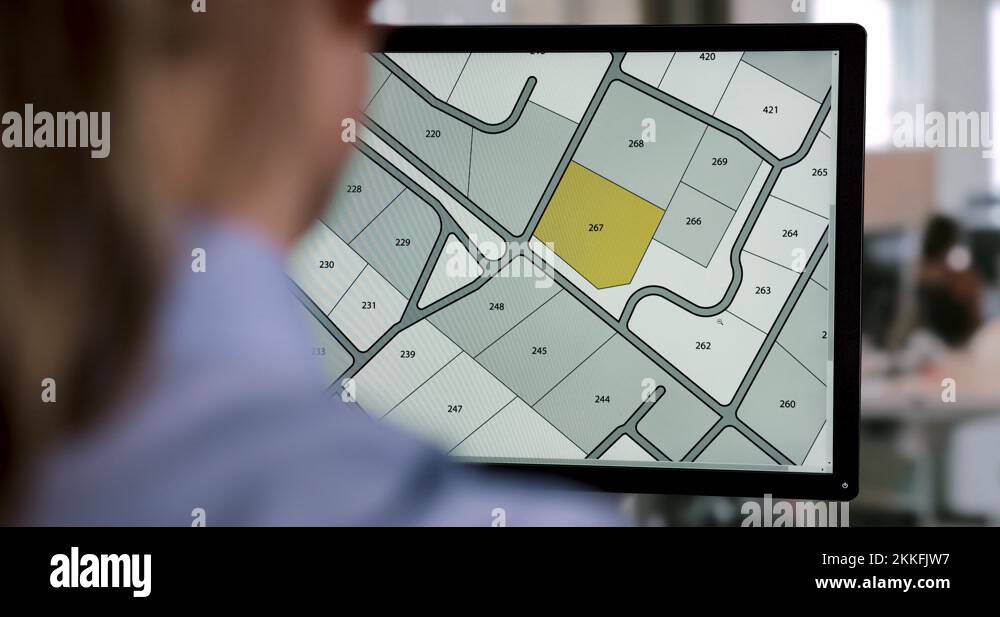 woman working with digital cadastral map land register database on ...