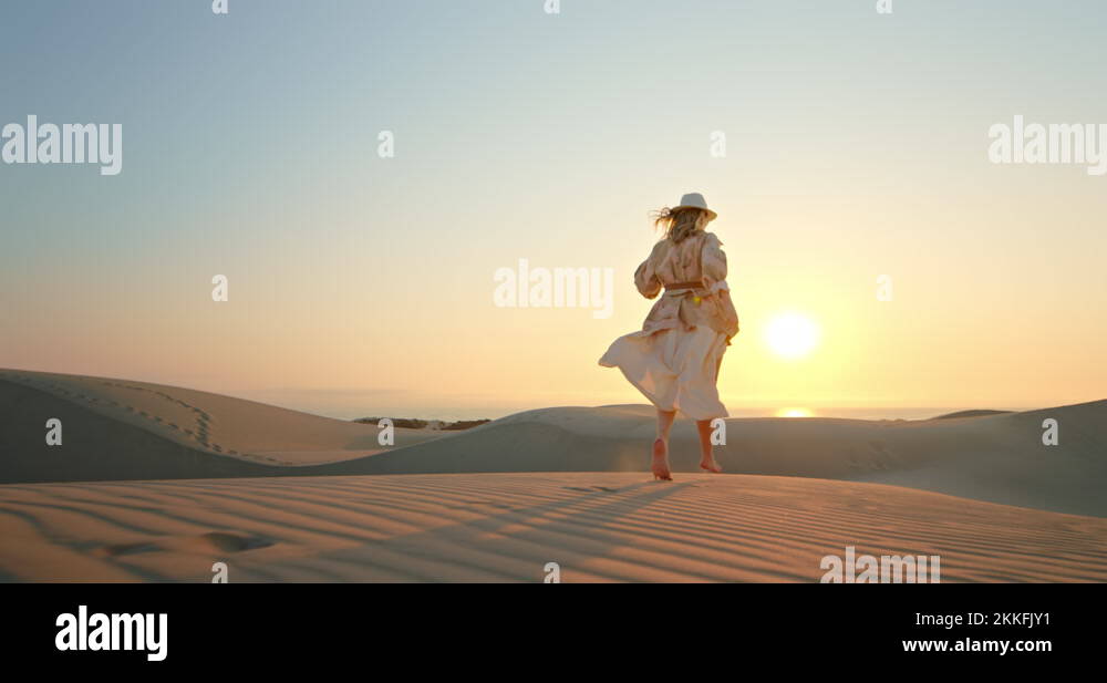 Inspirational 4K of model in safari clothes. Woman running toward the ...