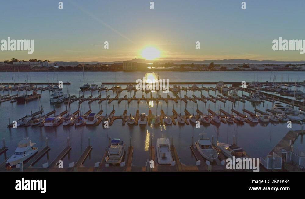 Sunset behind the Vallejo Marina, reflection in the blue still water lined Stock Video Footage ...