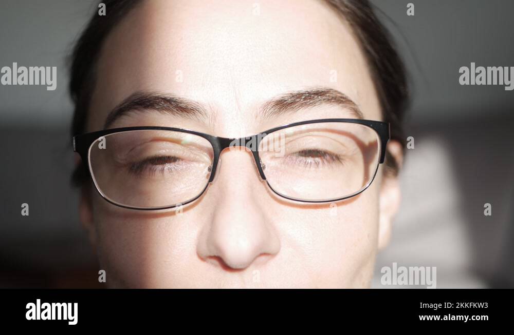 Woman face illuminated by sunlight falling from window Stock Video ...