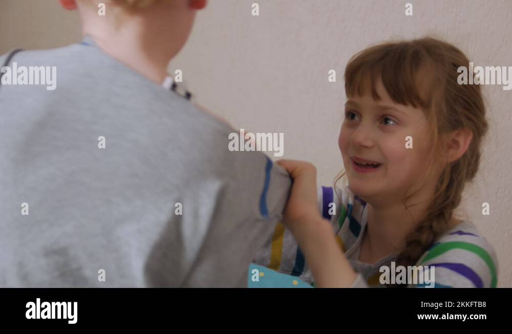 Brother helping sister dress Stock Videos & Footage - HD and 4K Video ...