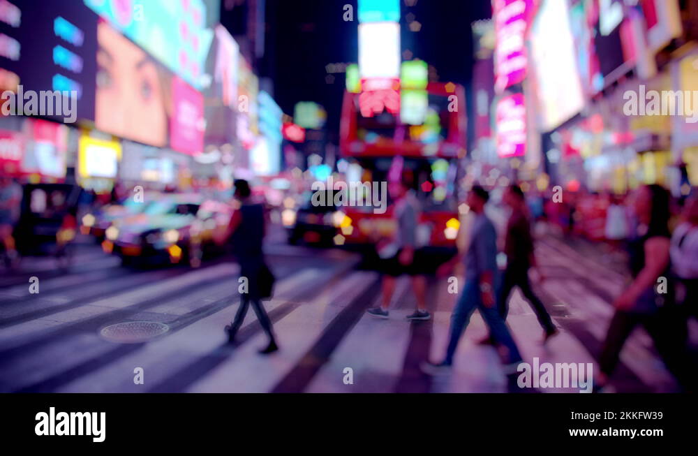 Times Square New York City blurry pedestrian street crossing colorful ...