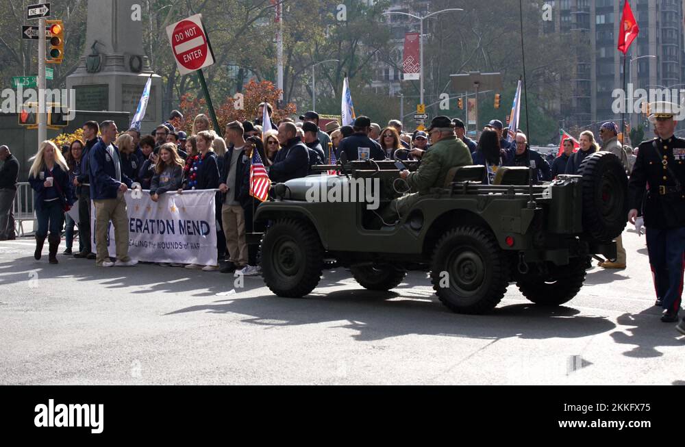 Jeep Willys during Veterans Day Parade in NYC. People cheering for ...