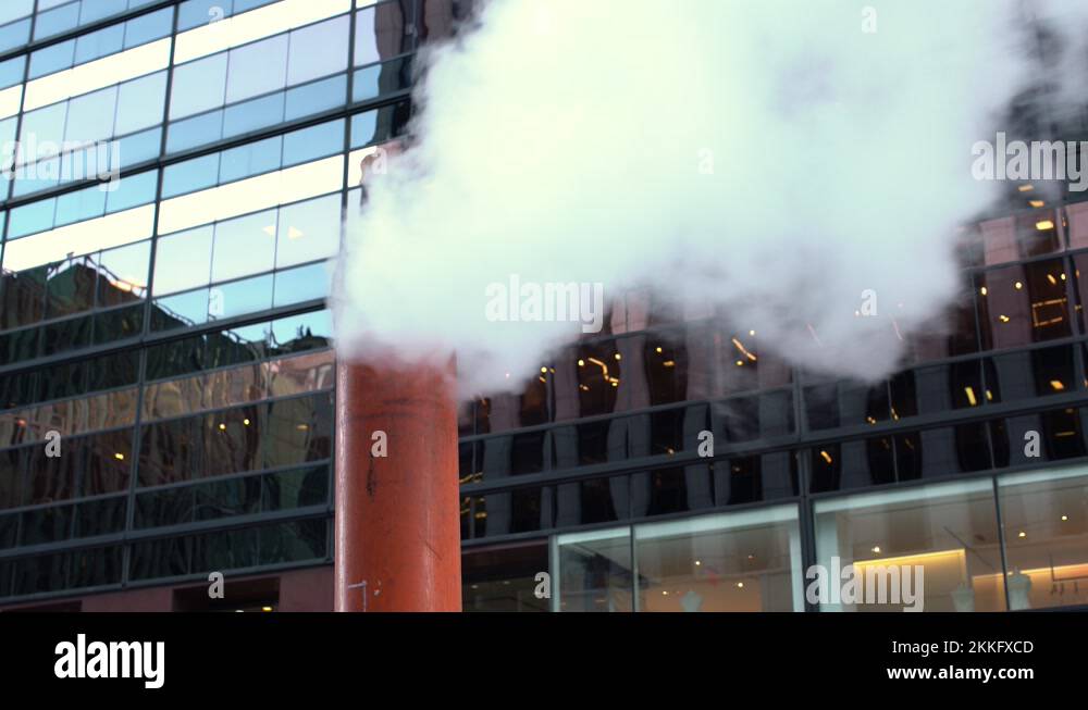 Steam Heat system malfunction and White Steam escaping ground Stock ...