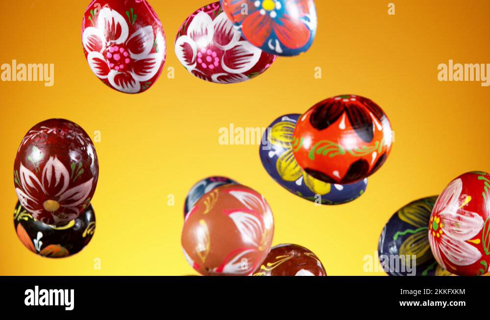 Super slow motion of flying colored easter eggs, ramp speed effect ...