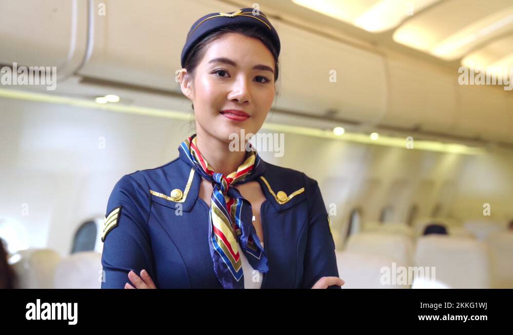 Cabin crew or air hostess working in airplane Stock Video Footage - Alamy