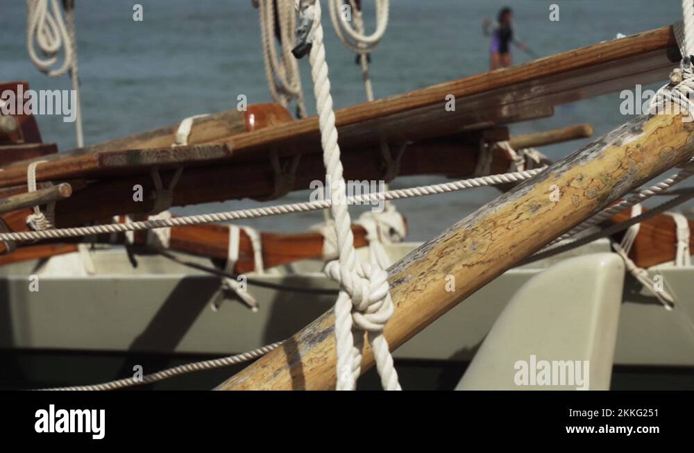 Catamaran Polynesian double-hulled ship deck rigging with winch and ...
