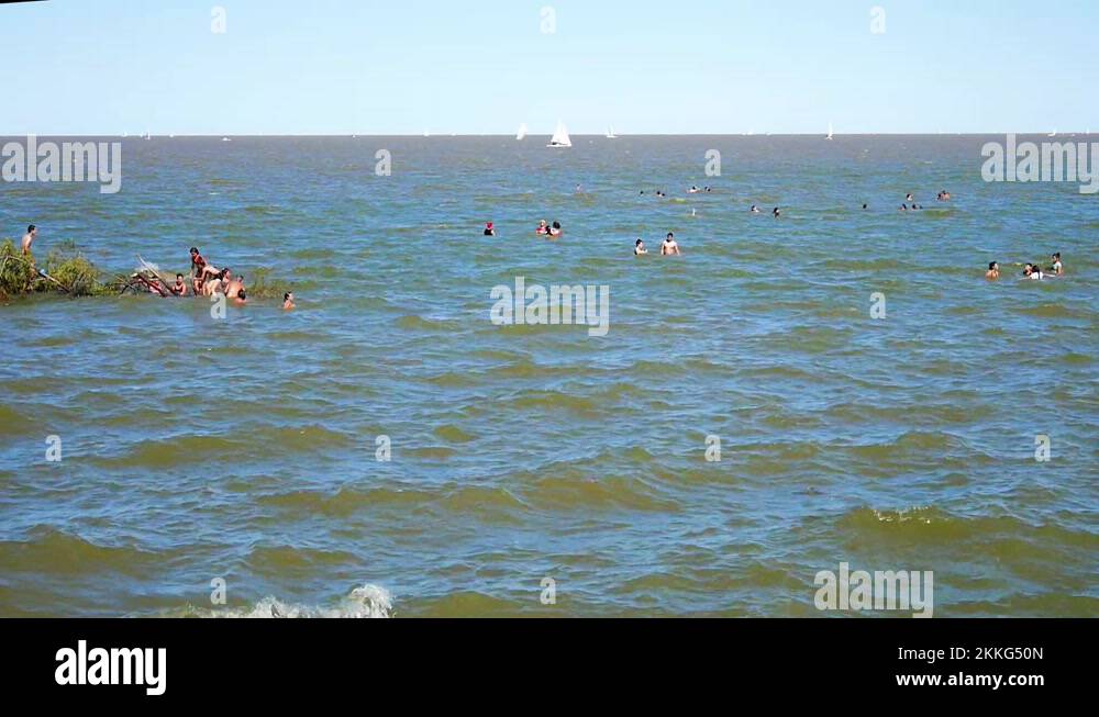 People bathe in the Rio de la Plata in Buenos Aires, Argentina on a hot Stock Video Footage - Alamy