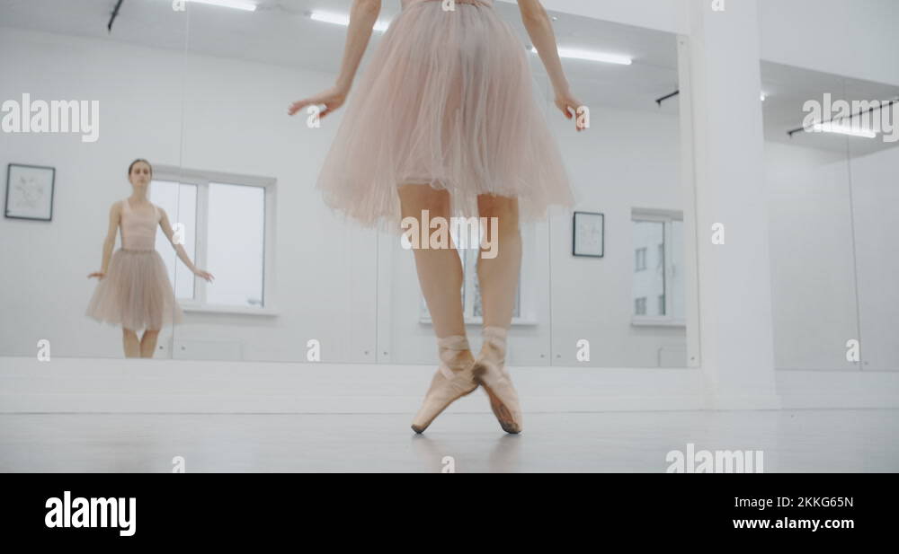 Ballerina dances on the ends of her pointe shoes, woman dance on her ...