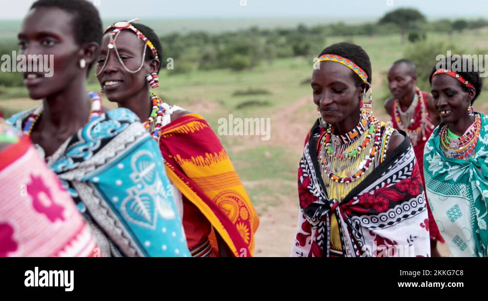 Masai Mara Tribe women in full traditional garb and jewelry walking ...