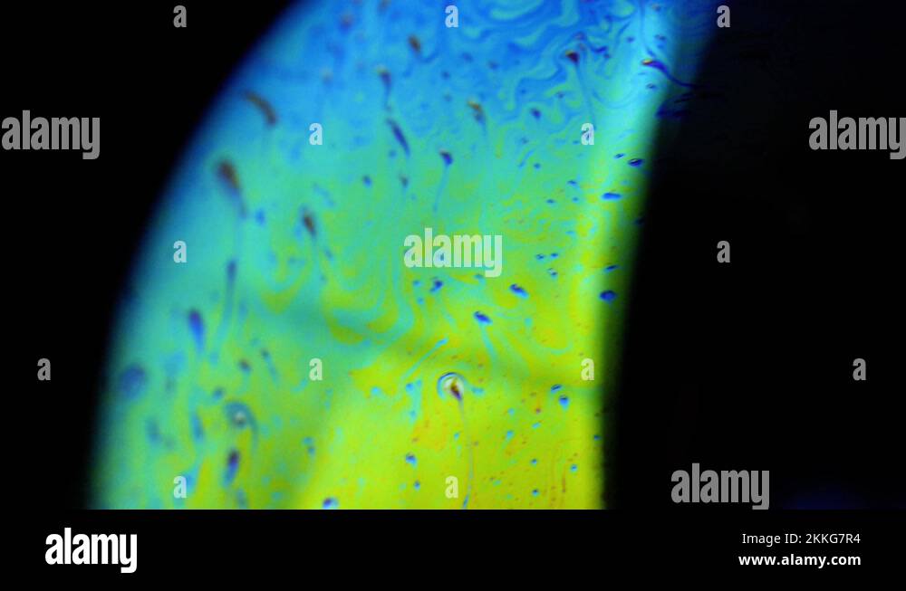 4k stable shots of soap balloons showing the colors of the macro world ...
