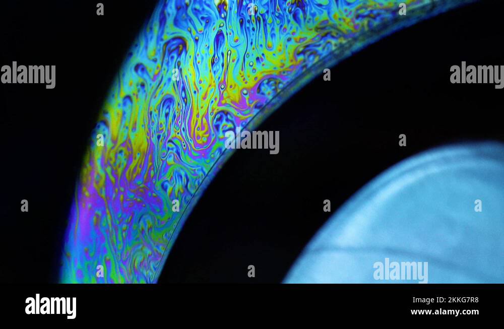 4k stable shots of soap balloons showing the colors of the macro world ...