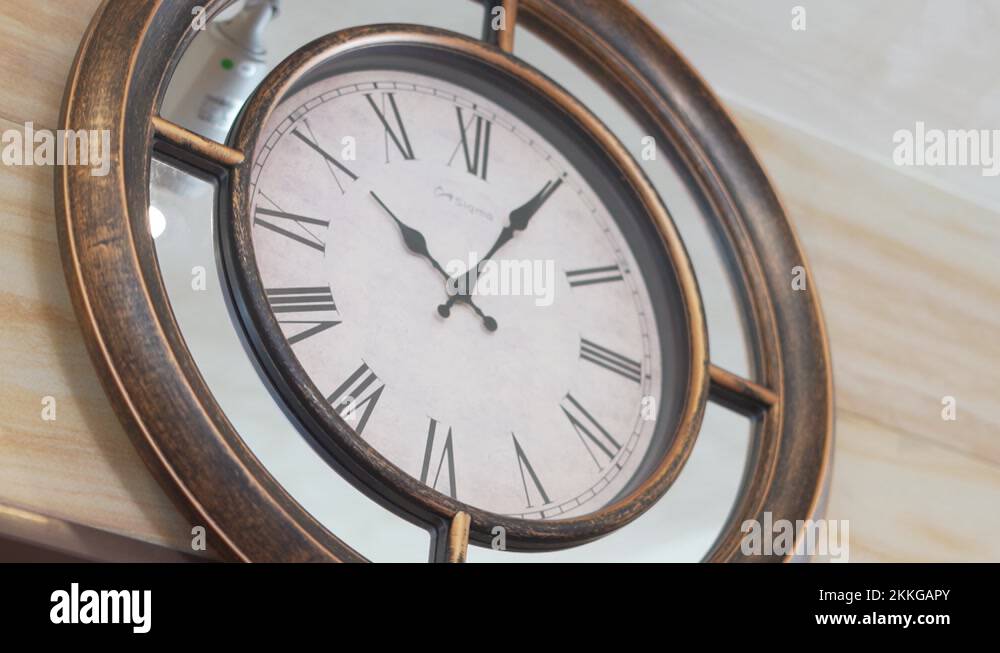 Wall round clock that shows five past ten o'clock. Old and big vintage ...