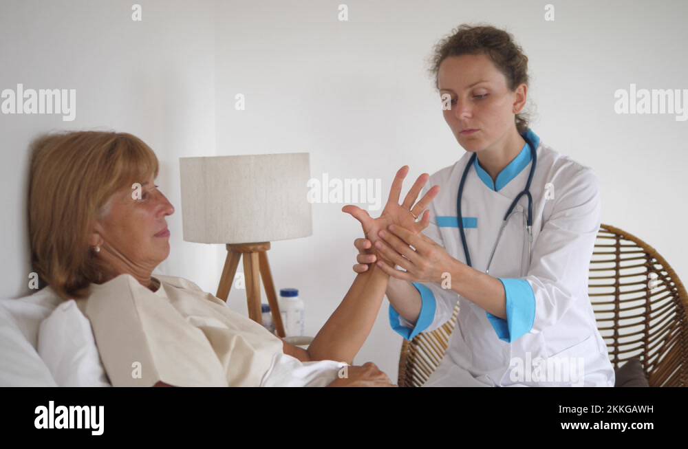 Health worker woman performing diagnosis test on the patients hand to ...