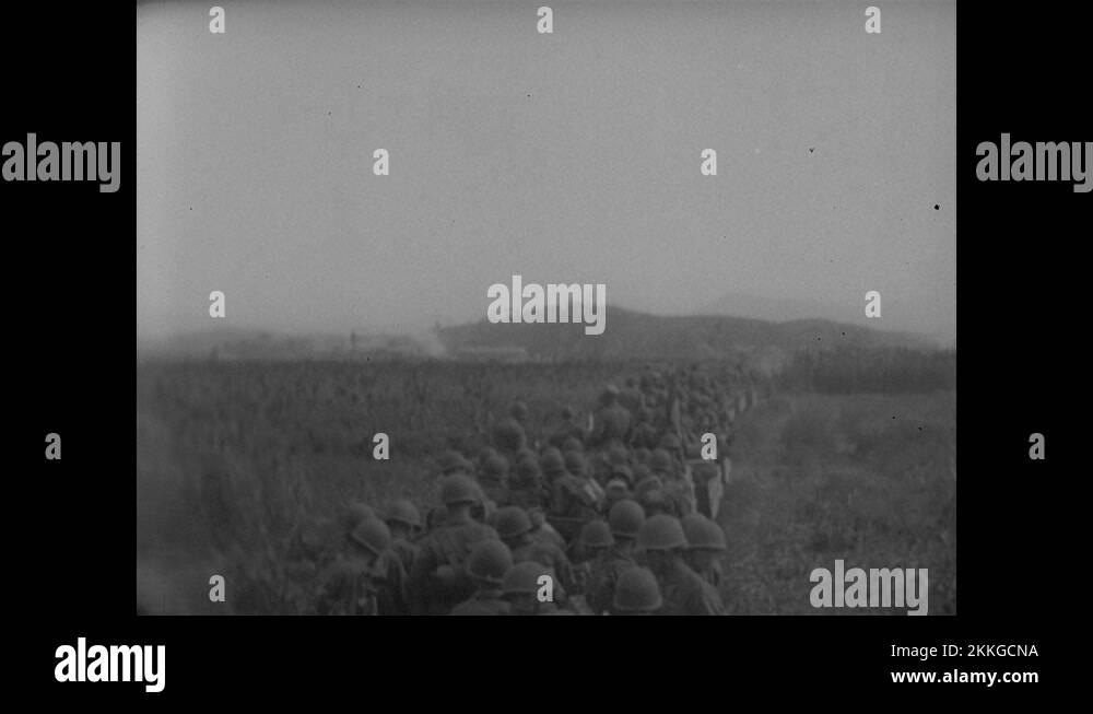 1950s: Tanks drive down road. Soldiers in vehicles on road. Soldier ...