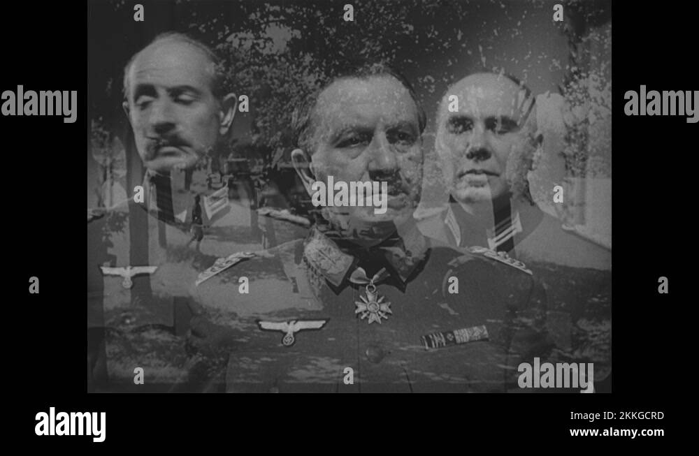 1940s: Army officer points at map on wall. Other officers watch him ...