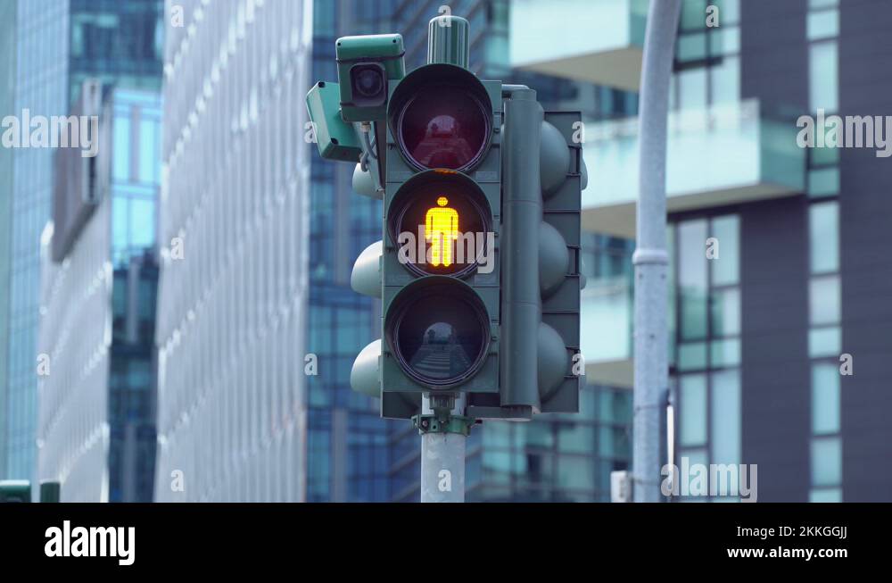 In the bustling area of Milan, Italy, traffic light changing from green ...