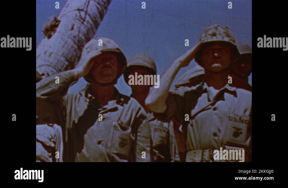 1940s: Shots of soldiers saluting. Low angle of flag. Soldier saluting ...
