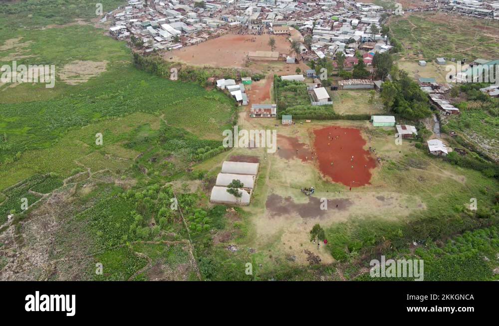 Kids playing in slums of Kibera Nairobi Kenya, footage pitch in the ...
