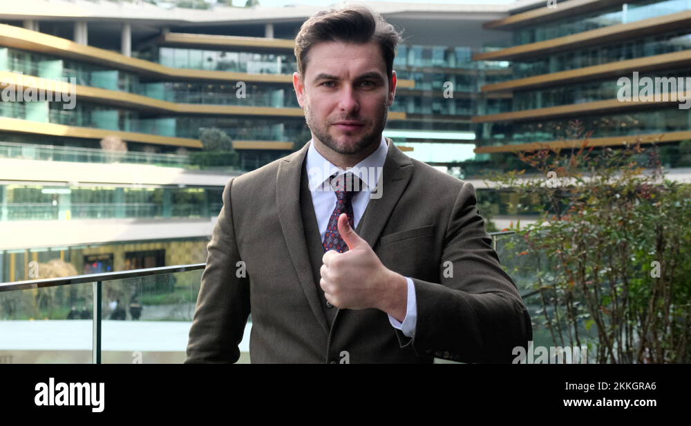 Business man shows thumbs up points. showing thumb up gesture panorama ...