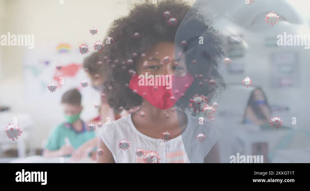 Animation of floating covid 19 cells and schoolgirl in class wearing ...