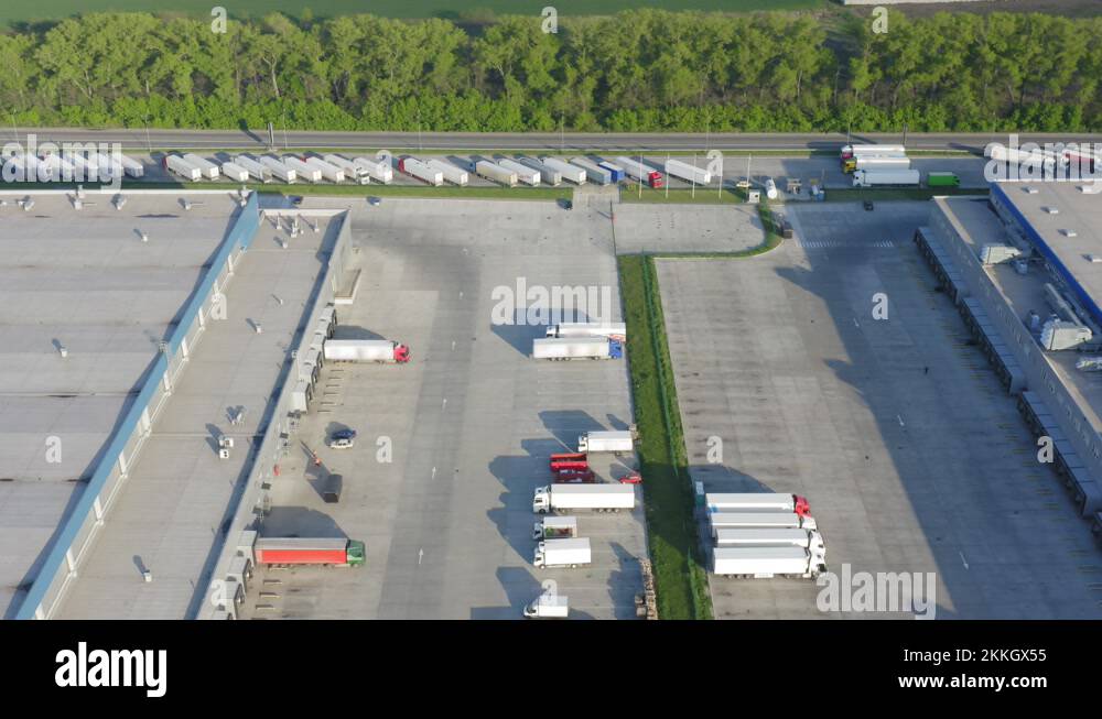 Logistics park with a loading hub. Semi-trailers trucks stand at ...