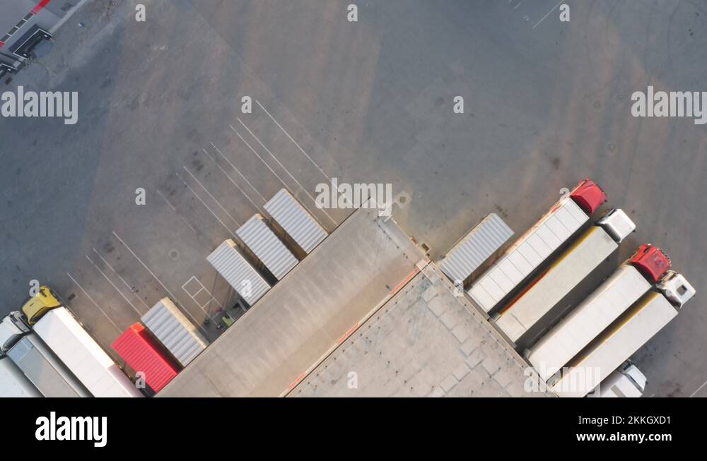 Semi-trailers trucks stand at warehouse ramps and wait for load and ...