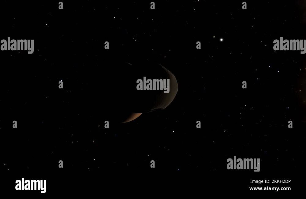 Mars and it's distant moon Deimos are shown passing from night to day ...