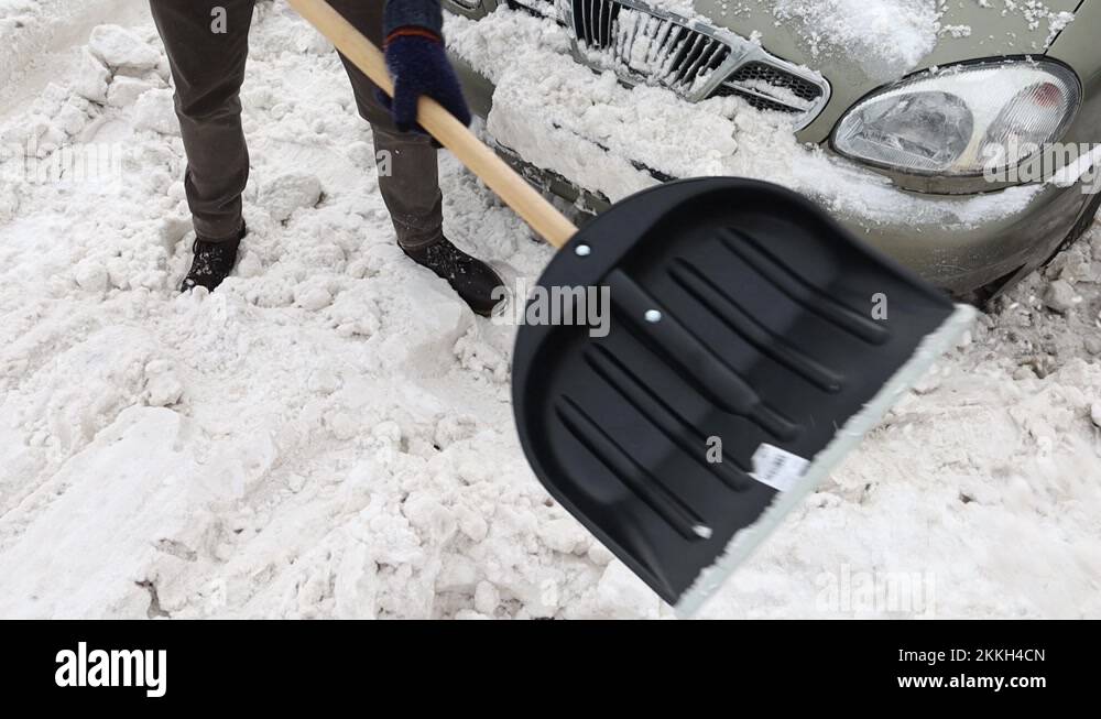 Man Digging Car Out Of The Snow In Cold Winter Stock Video Footage - Alamy