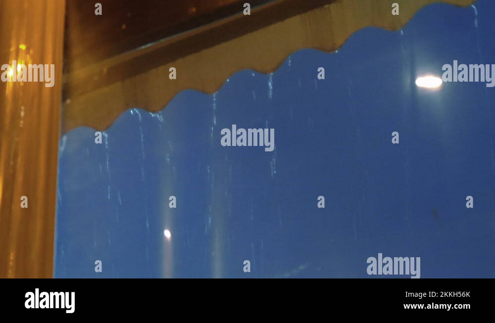 Rain Pouring Off Roof During Rainy Season In Delhi, India - low angle ...