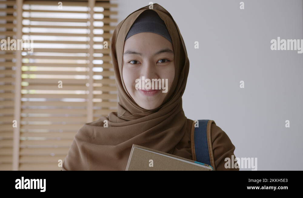 Happy Muslim girl smile on the face, Portrait student women wear brown ...