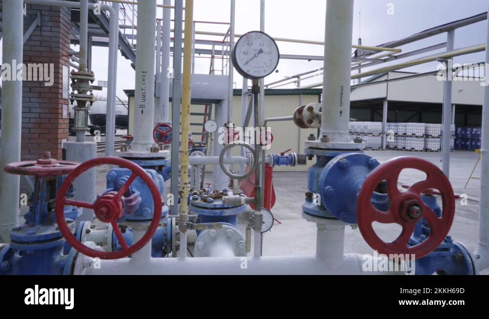 Pipeline with levers and meter at gas oil refinery complex Stock Video ...