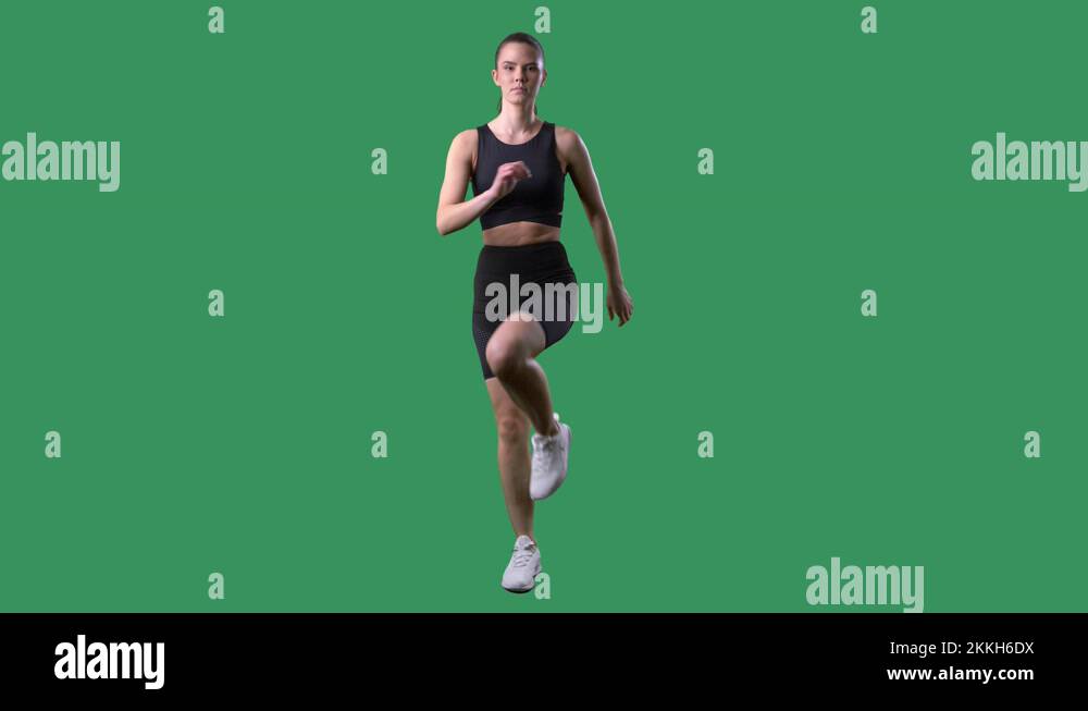 Fit woman legs and ankle rotation and stretching exercises on green ...