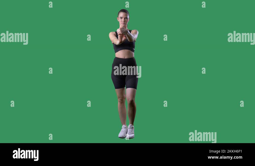 Gym woman arm stretching and wrist rolls exercises. Full body on green ...