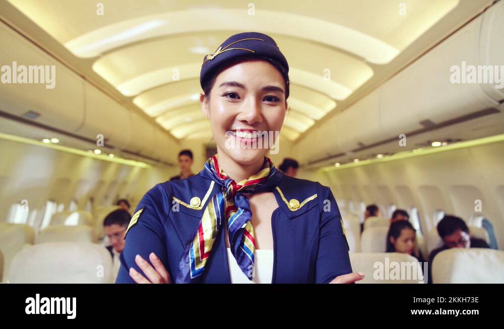 Cabin crew or air hostess working in airplane Stock Video Footage - Alamy