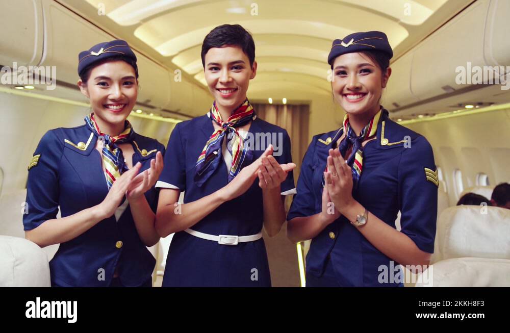 Cabin crew clapping hands in airplane Stock Video Footage - Alamy