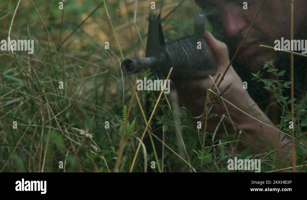 Portrayal of Soldiers, under fire - combat in Vietnam War era with M-16 ...