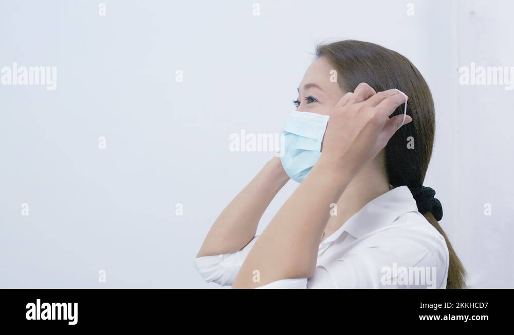Asian women are removing the correct medical masks Stock Video Footage ...