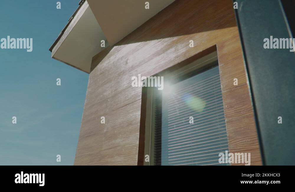 Sunlight flare on window, reflection on window's house in the outside ...