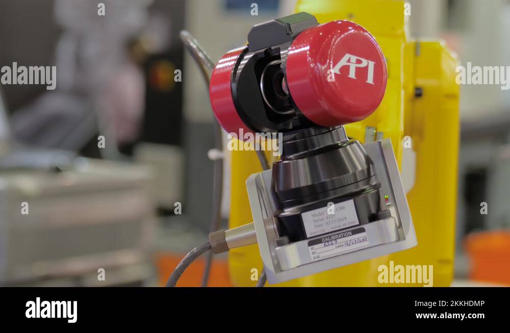 Industrial robotic arm manipulator with laser tracker camera at robot ...