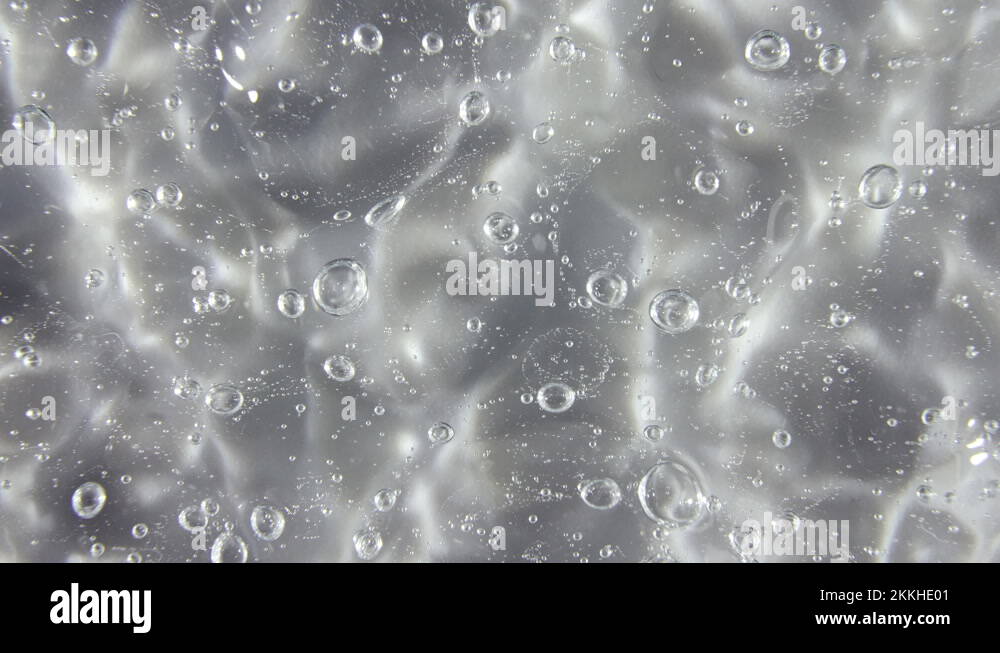 Transparent liquid gel background, clear serum texture. Motion ...