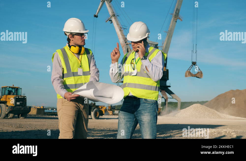 Engineers are talking over a project in the mining zone Stock Video ...