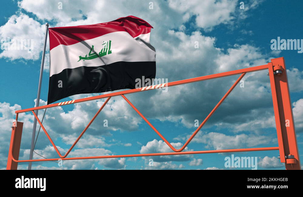 Manual swing arm road barrier and flag of Iraq. Restricted entry ...