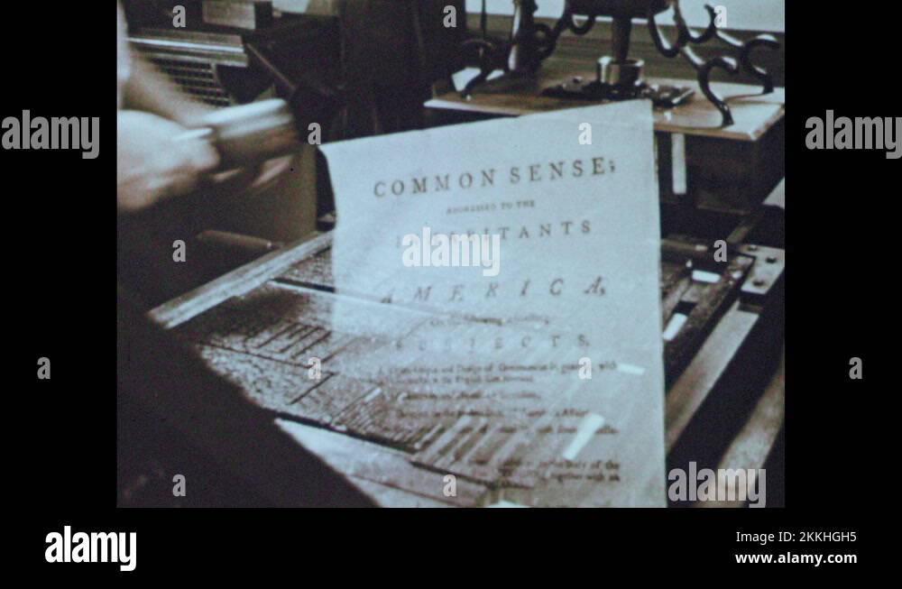 1950s: Plates on printing press, image of pamphlet over plates, man ...