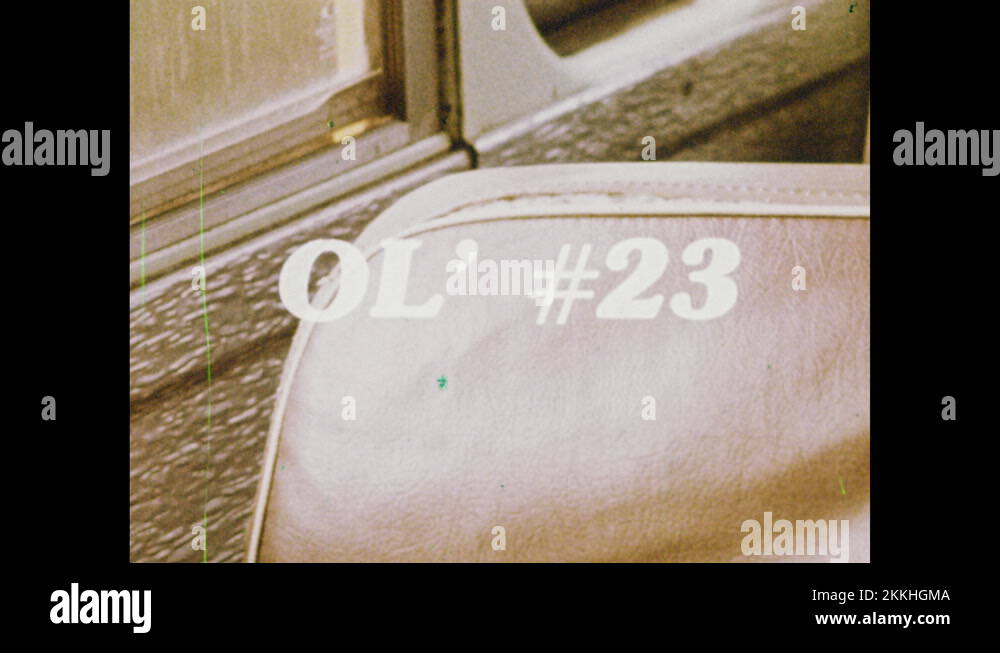 1970s: Title card: Ol' #23. Hand pulls fabric from seat. Hole in vinyl ...