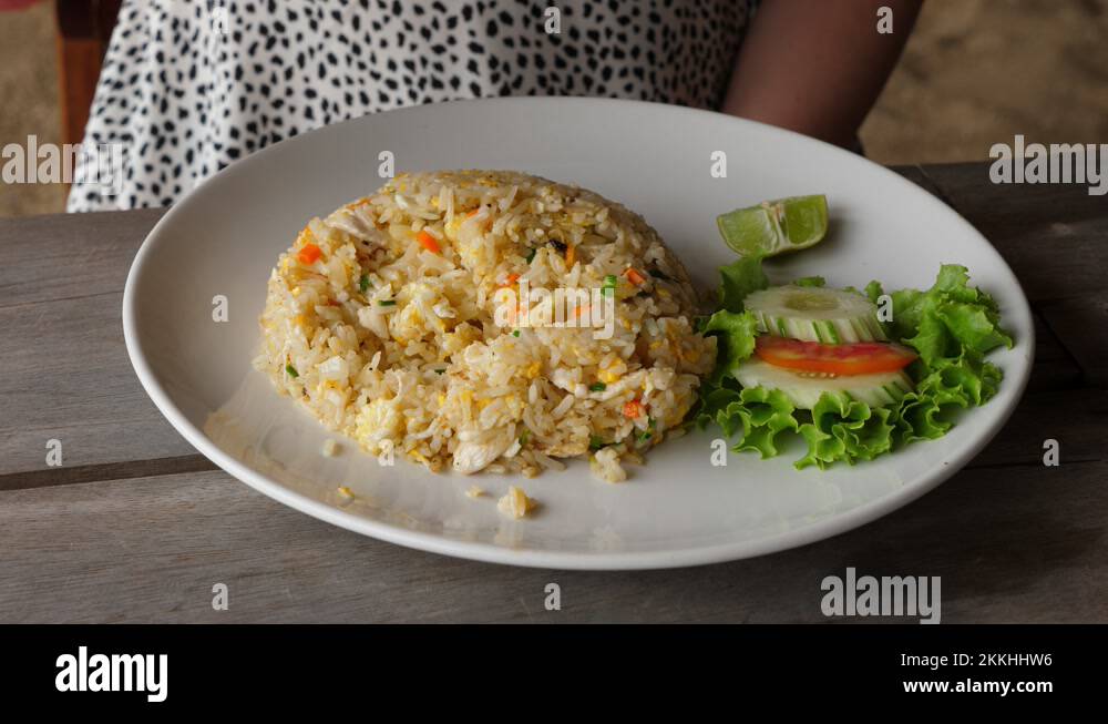 Plate of fried rice with chicken, popular and tasty meal in Thailand ...