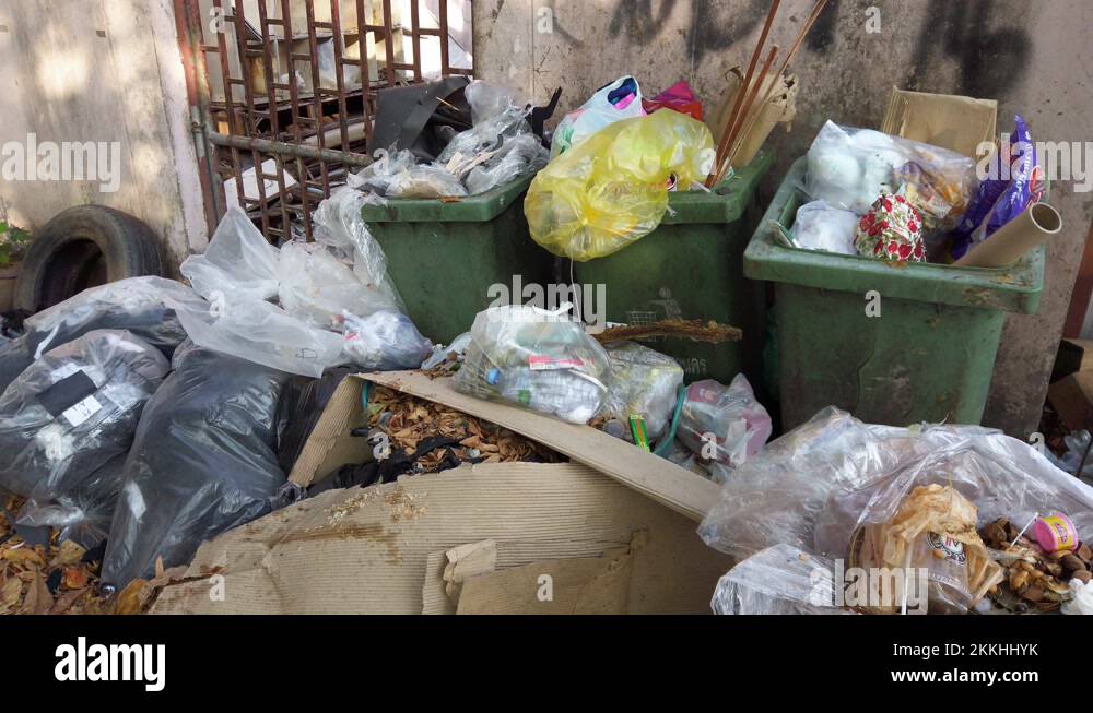 Pile Of Garbages And Green Containers Overflow With Plastic Trash In ...